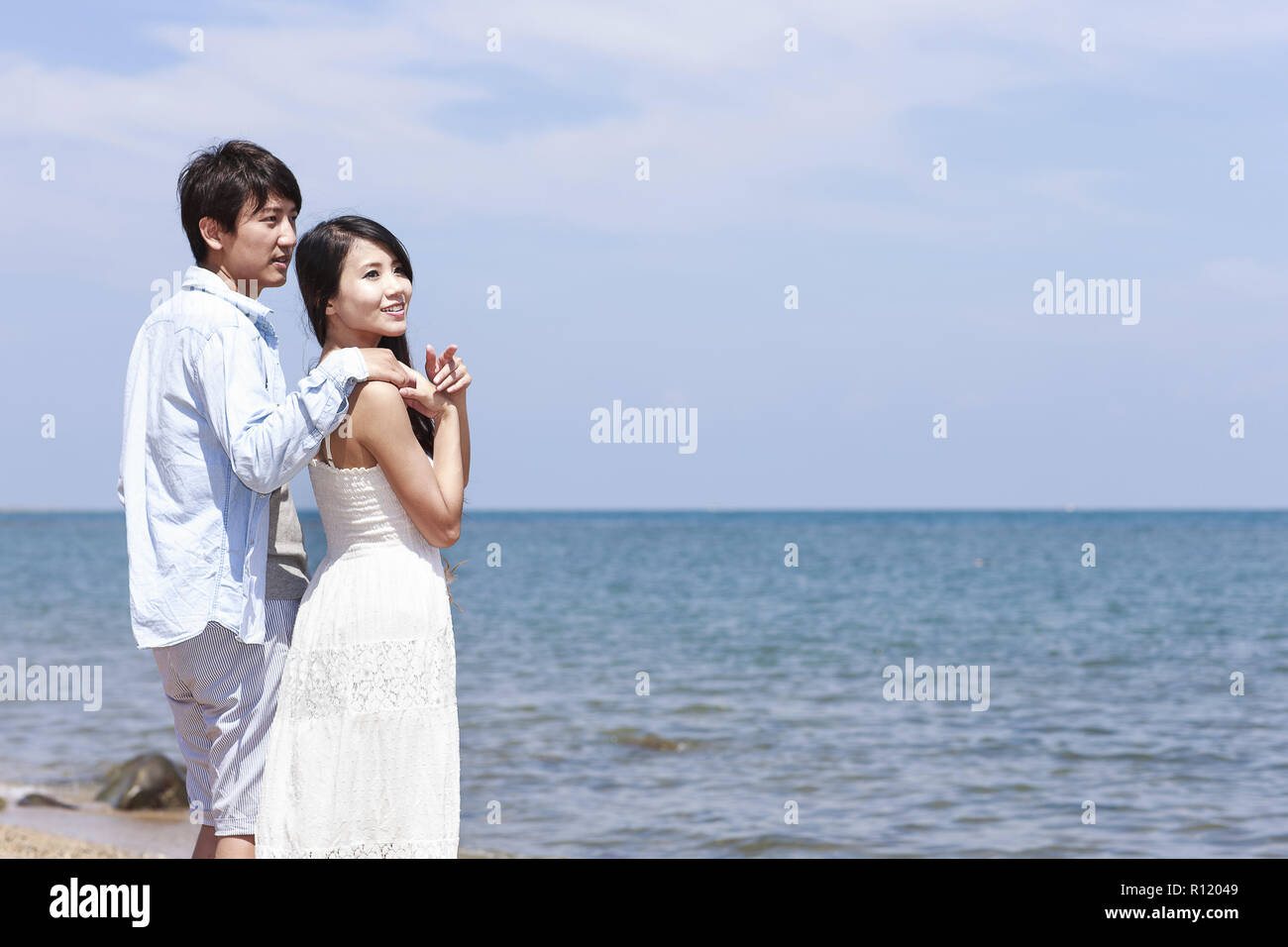 couple by the sea Stock Photo - Alamy