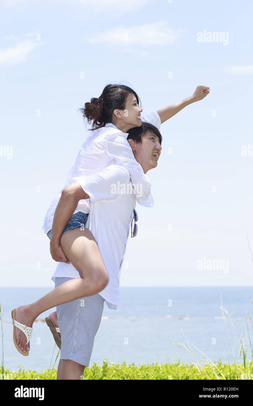 couple by the sea Stock Photo - Alamy
