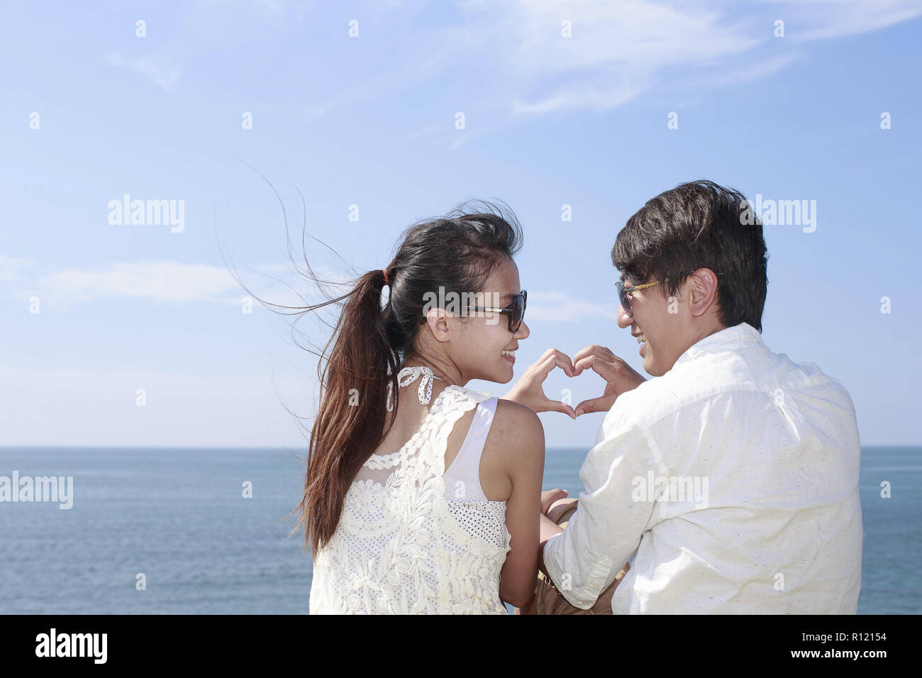 couple by the sea Stock Photo - Alamy