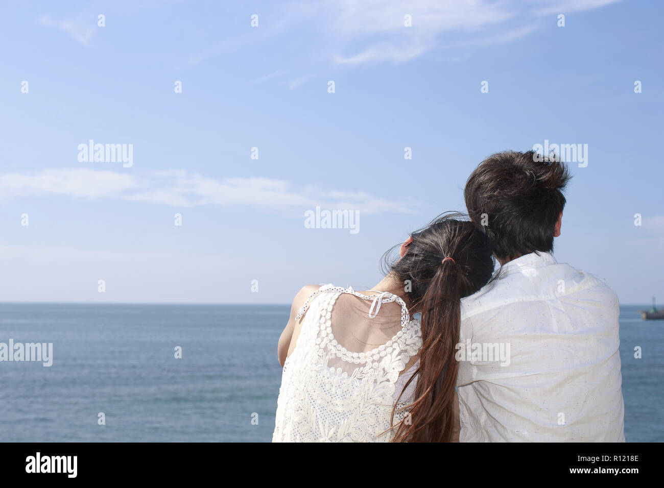 couple by the sea Stock Photo - Alamy
