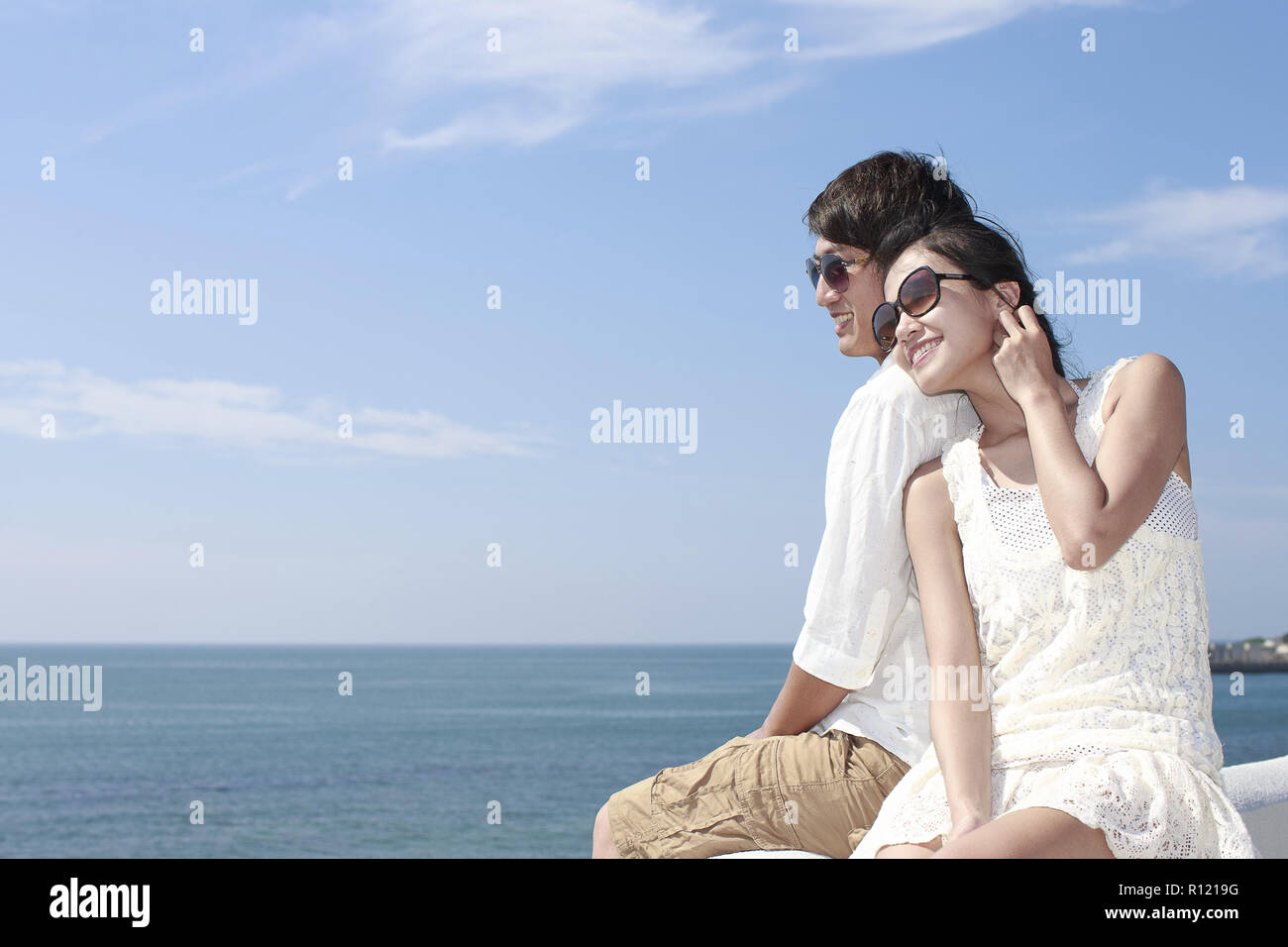 couple by the sea Stock Photo - Alamy