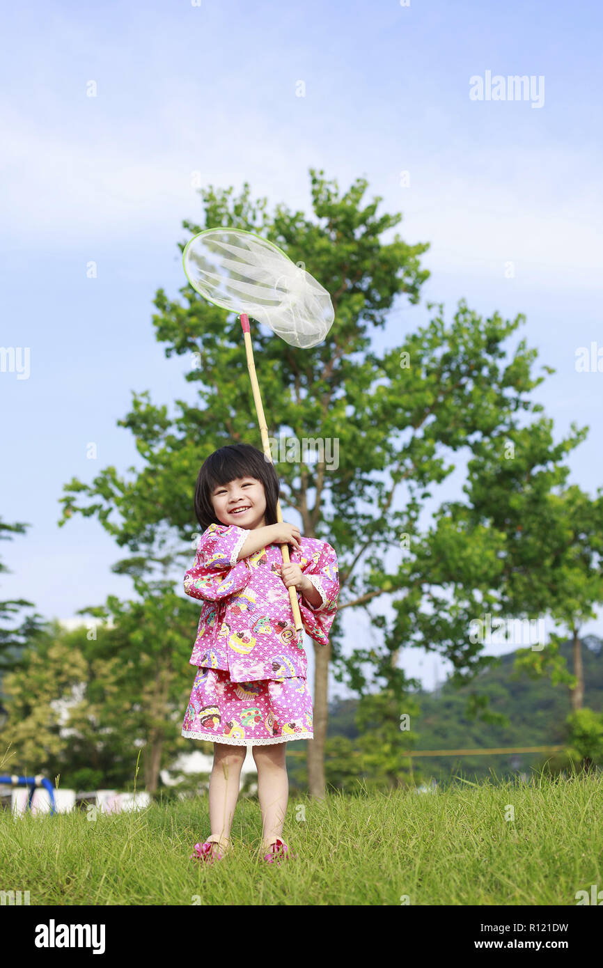 young girl with sweep net Stock Photo - Alamy