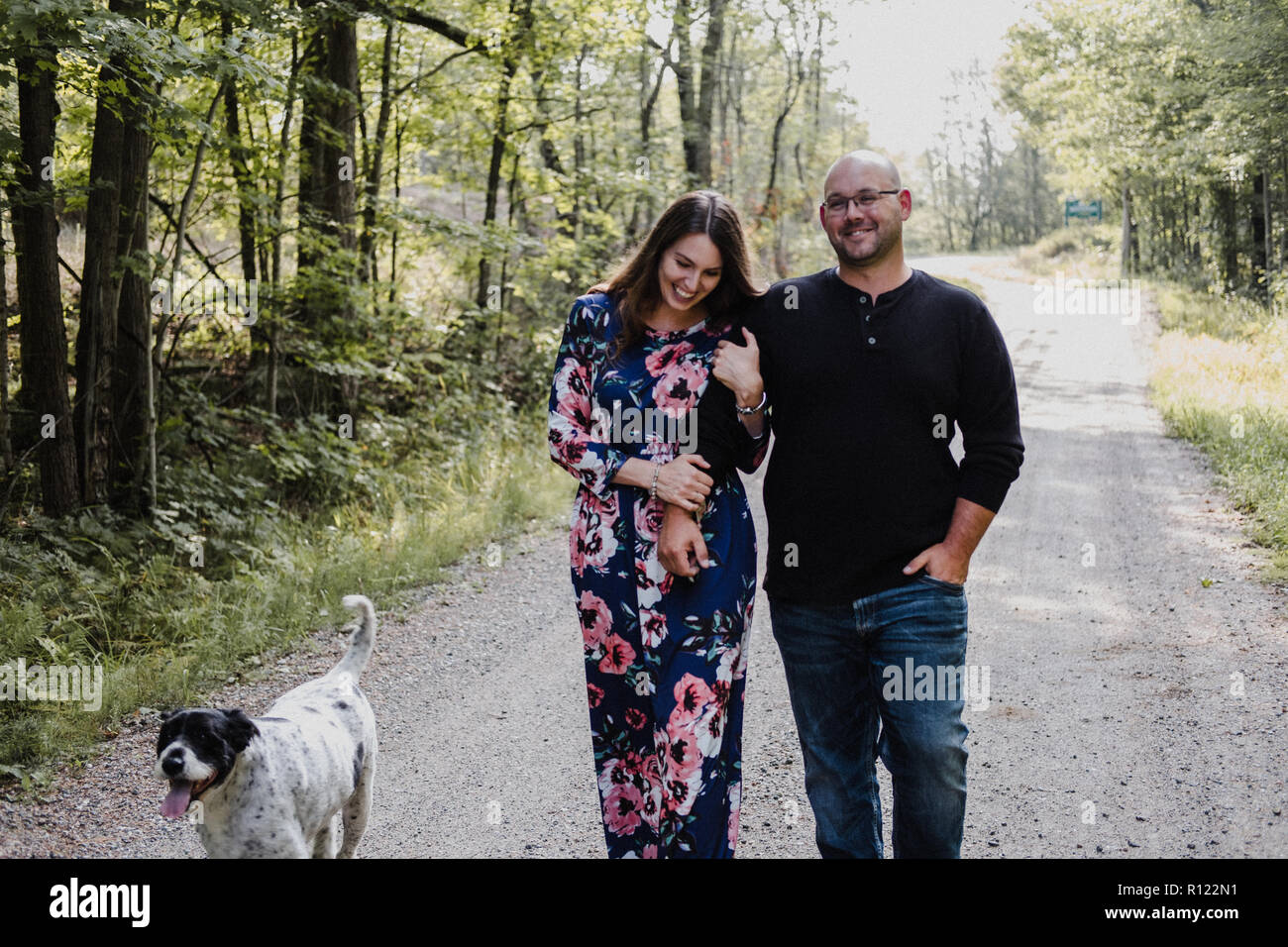 Man walking dog on road hi-res stock photography and images - Alamy