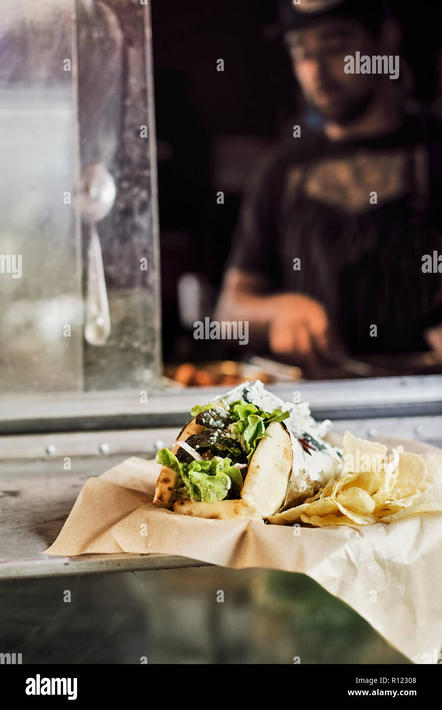 Man cooking in camper van food truck Stock Photo - Alamy