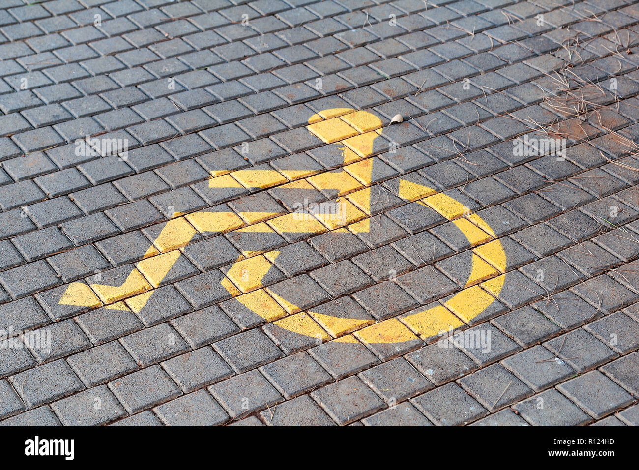 Post with disabled parking space and sign in front of parking bay in ...