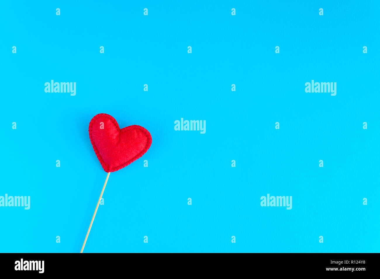 Felt love hearts on booth props on blue paper background. Valentine's ...