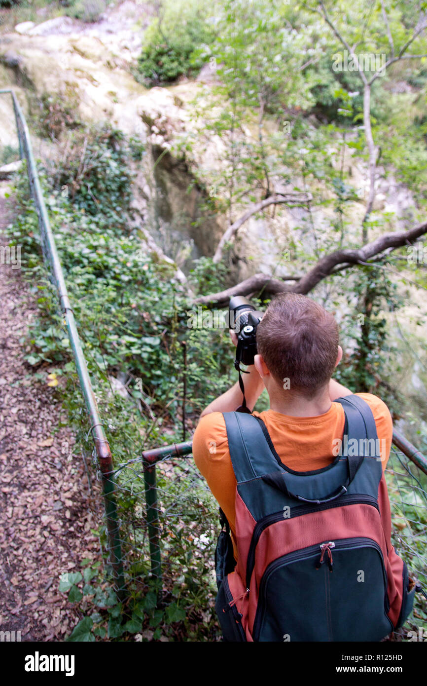 Professional male photographer in forest / Guys tourist in nature ...