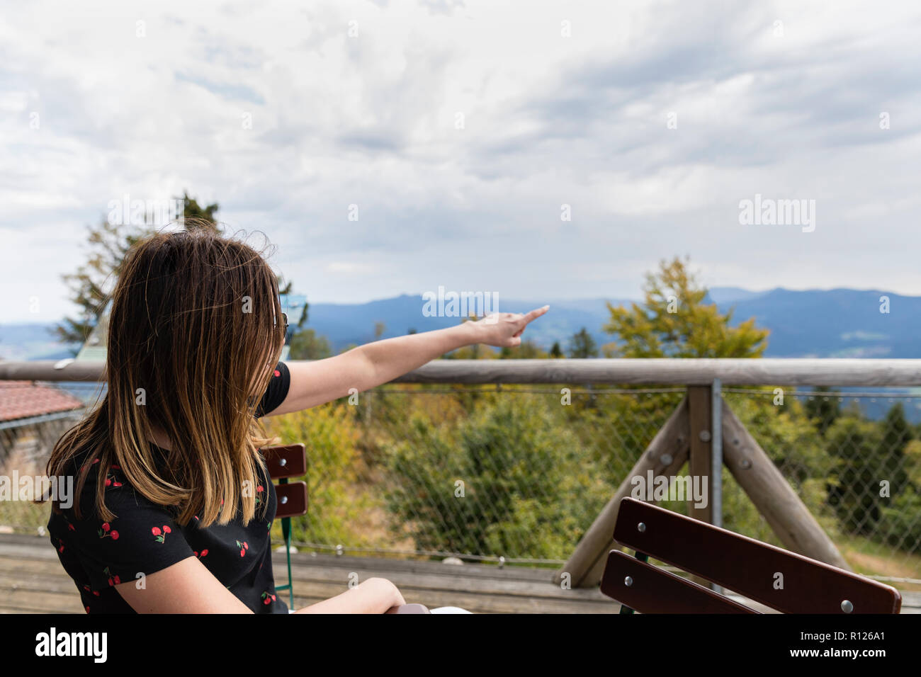woman looking at amazing woods and mountains in summer, travel concept ...