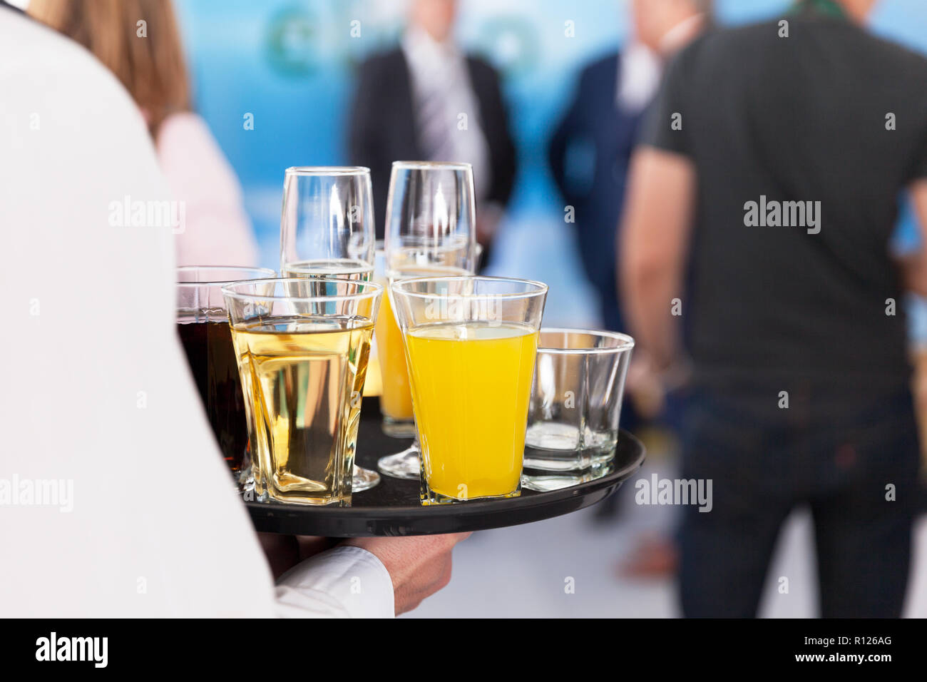 Closeup of a tray with drinks carried by a waiter at a party Stock ...