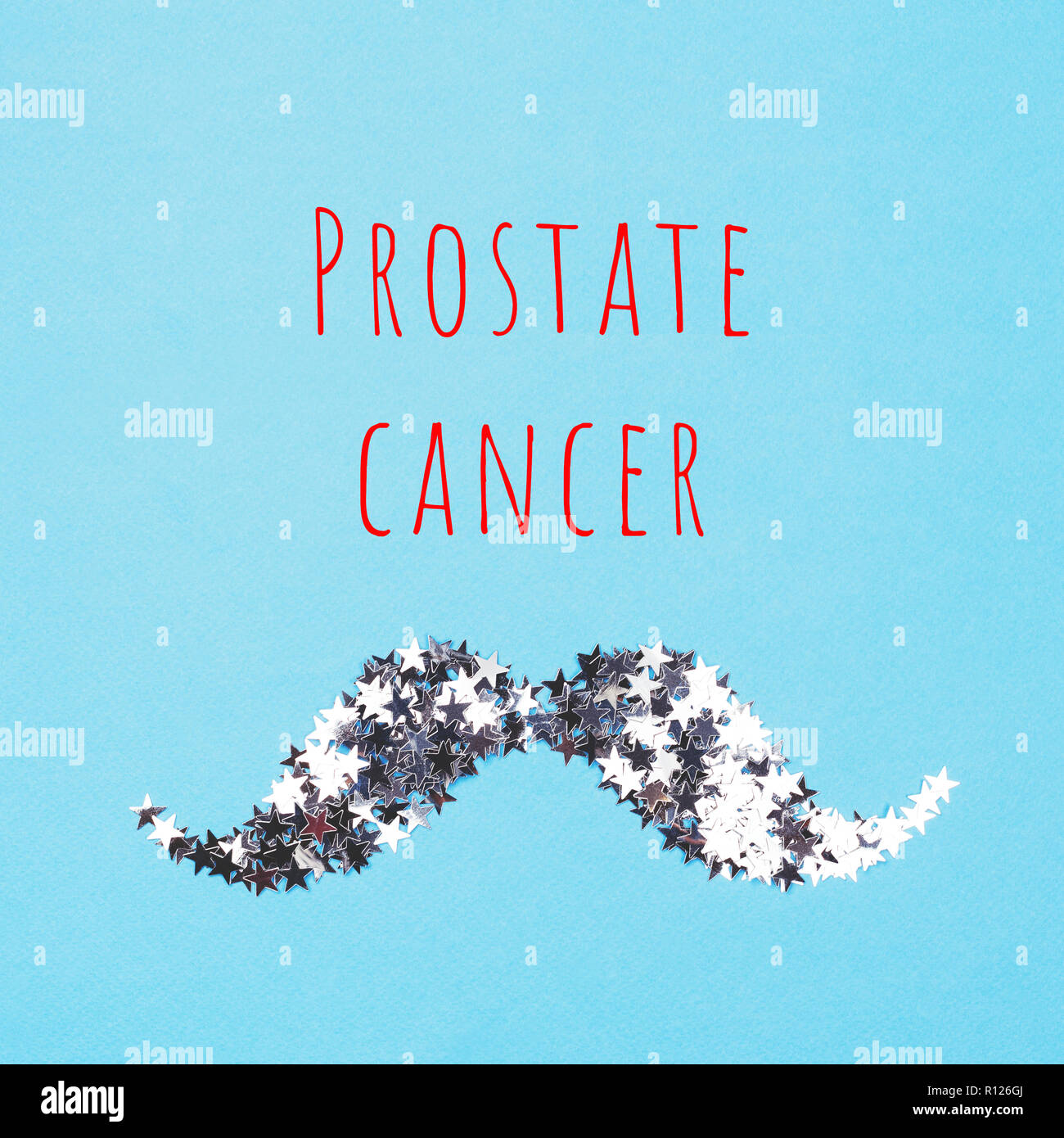 Mustache made of silver confetti on blue background. Prostate cancer ...