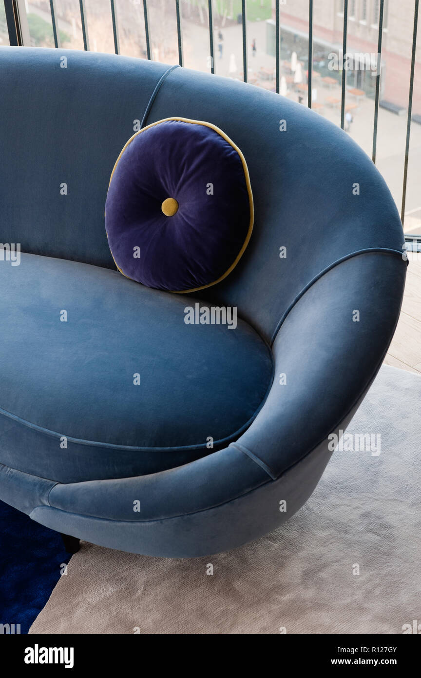 Blue cushion and sofa Stock Photo - Alamy