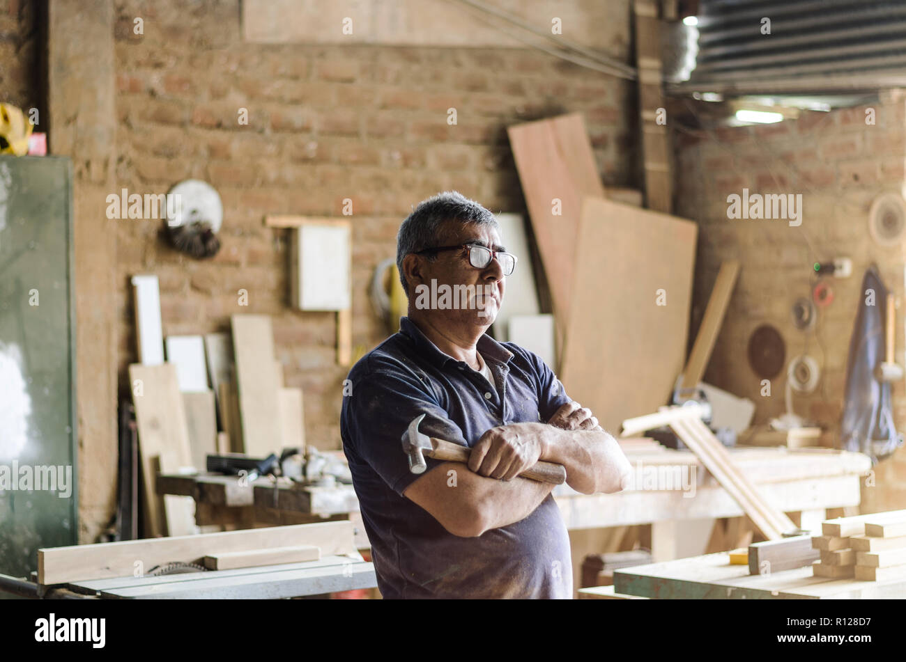 Portrait of senior carpenter. Standing with the background of your ...