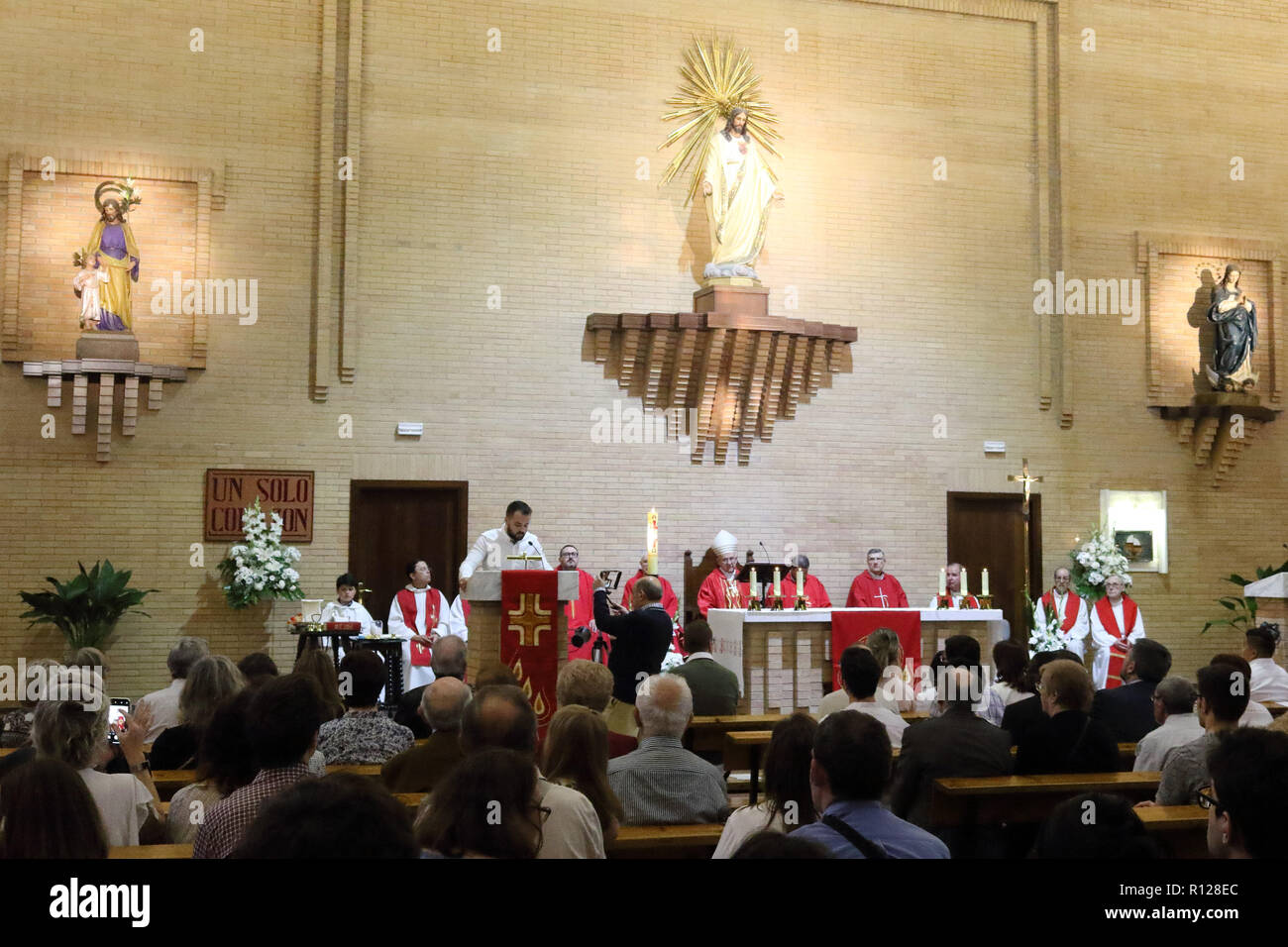 The celebration of a Roman Catholic mass with the archbishop and a ...