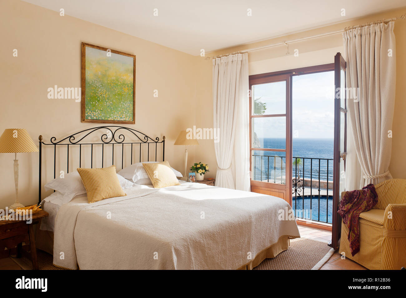 Country style bedroom with balcony Stock Photo - Alamy