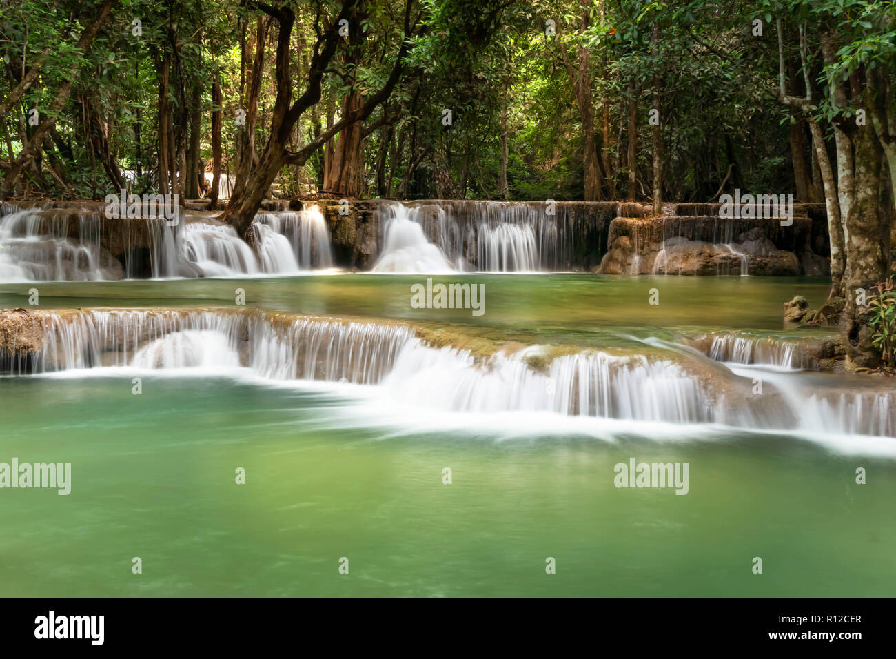 Fresh waterfall in rainforest at National Park, Thailand Stock Photo ...