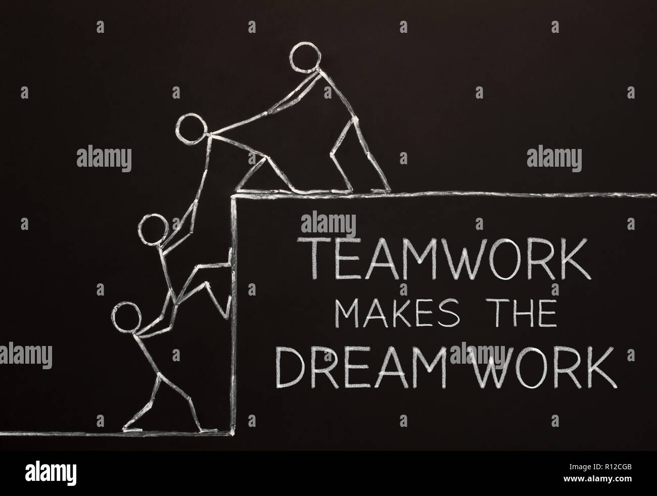Concept of a business team working together to accomplish their dream ...