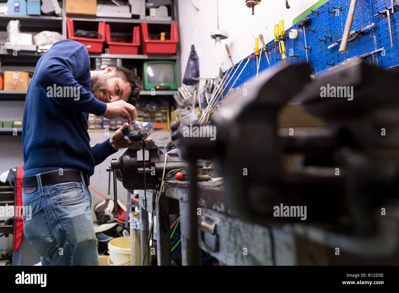 Fencing prop maker at work Stock Photo - Alamy