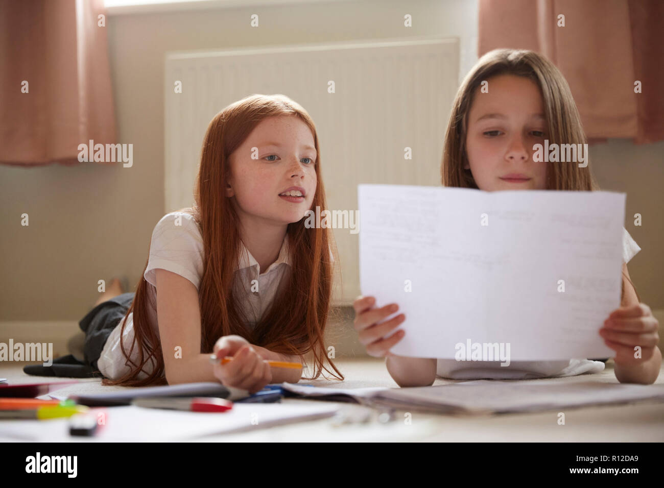 Girls doing homework Stock Photo - Alamy