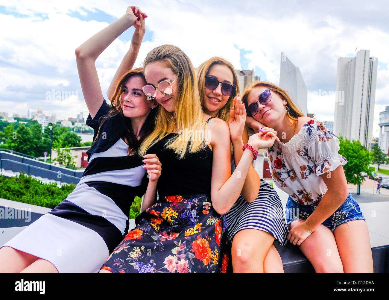 Four friends holding hands arms hi-res stock photography and images - Alamy