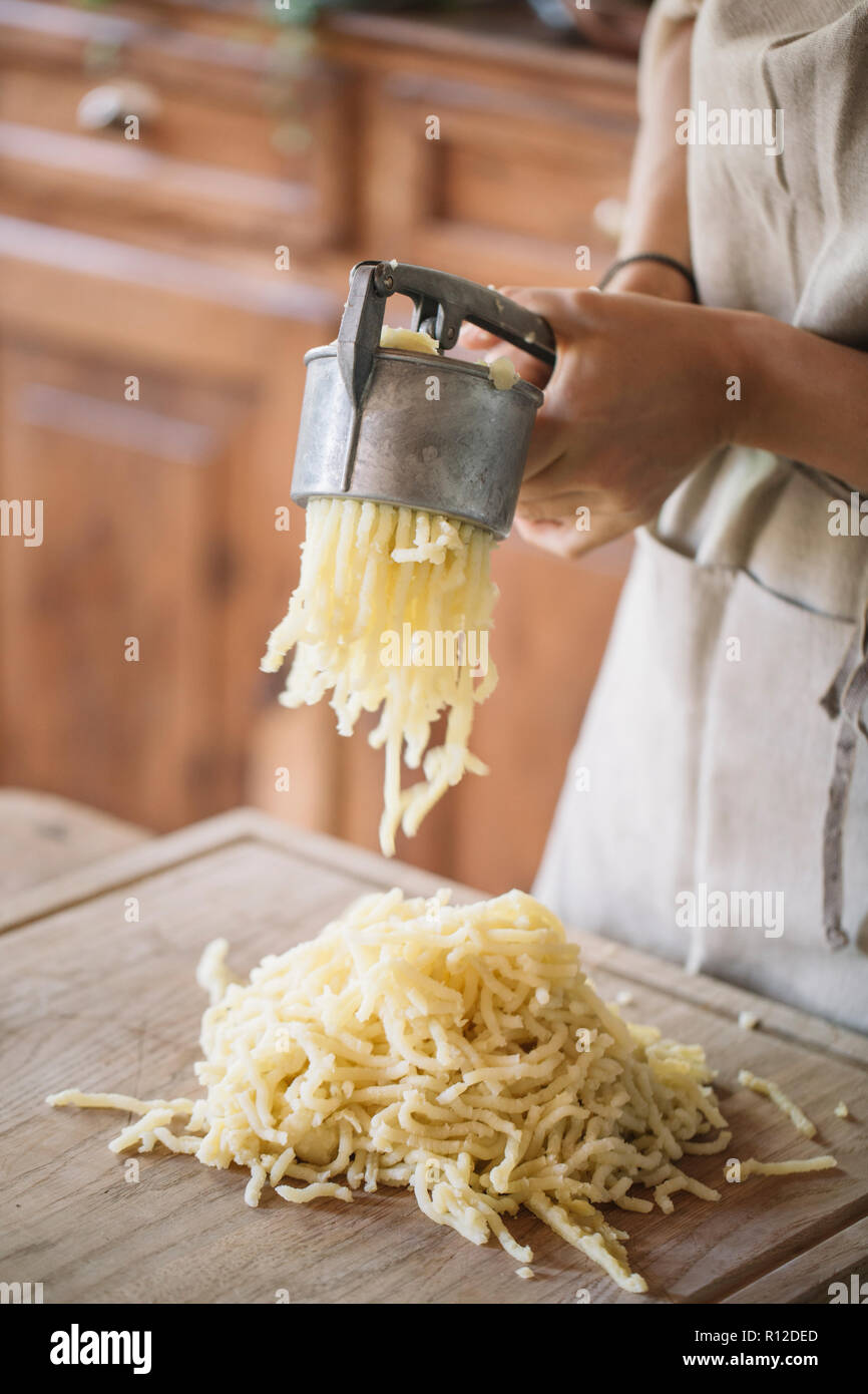 Woman cutting potato hi-res stock photography and images - Alamy