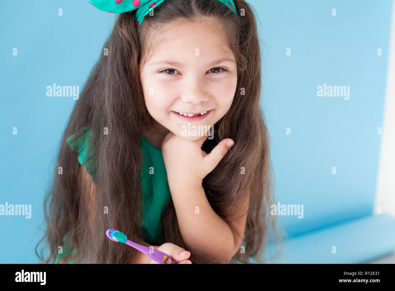 little girl tooth with a toothbrush dent Stock Photo - Alamy