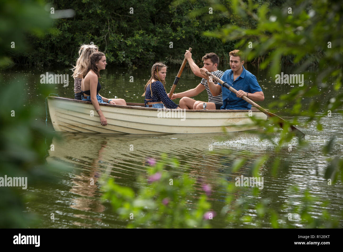Friends on boat ride in lake Stock Photo - Alamy