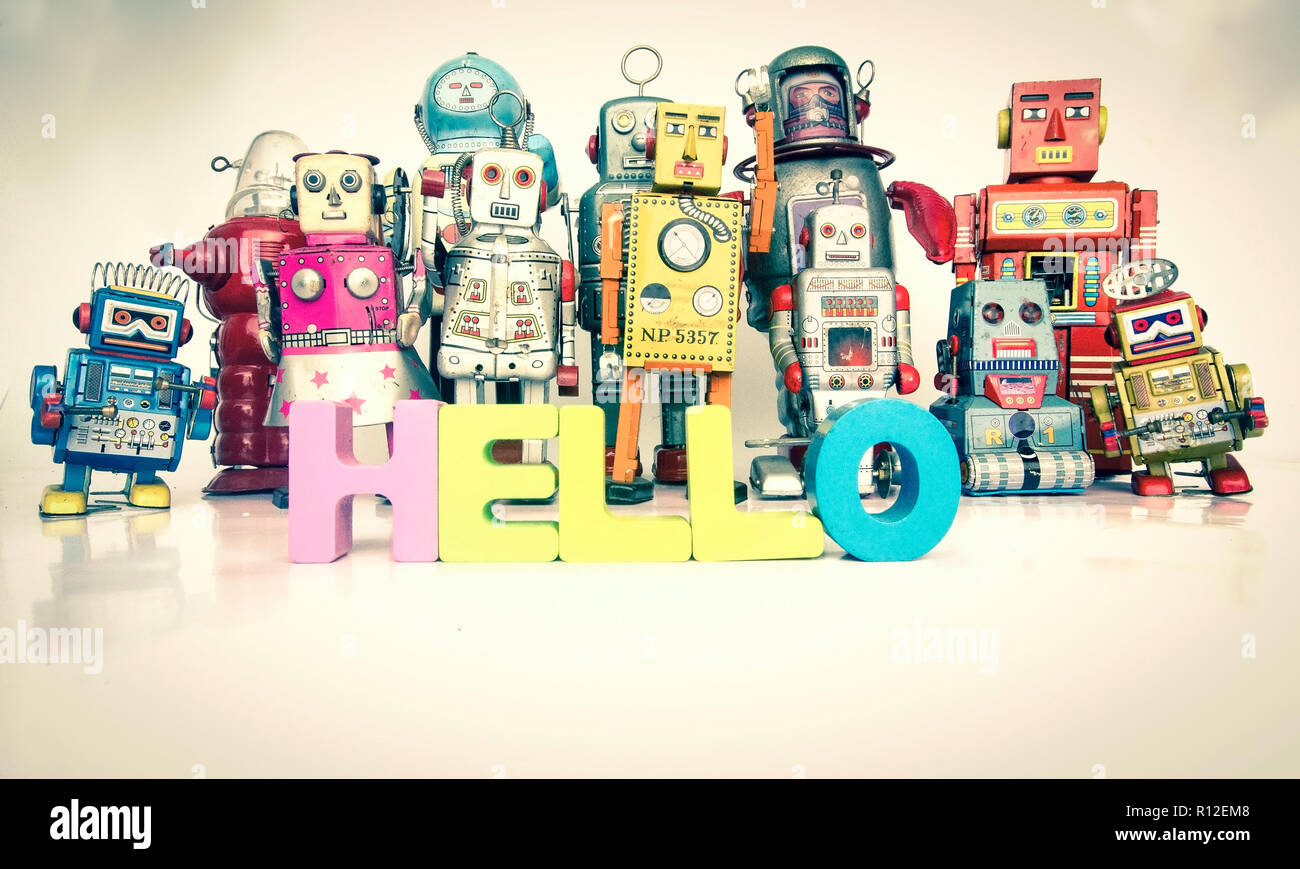 Big Family of robots with thw words HELLO with wooden letters Stock ...