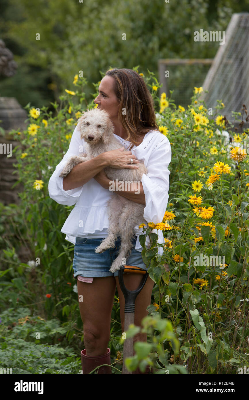 Carrying her dog hi-res stock photography and images - Alamy