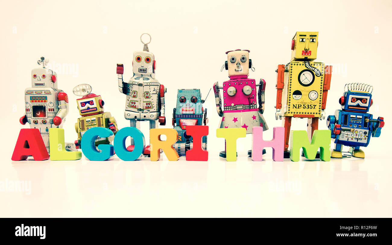 The word ALGORITHM with wooden letters and retro robot toys on white ...