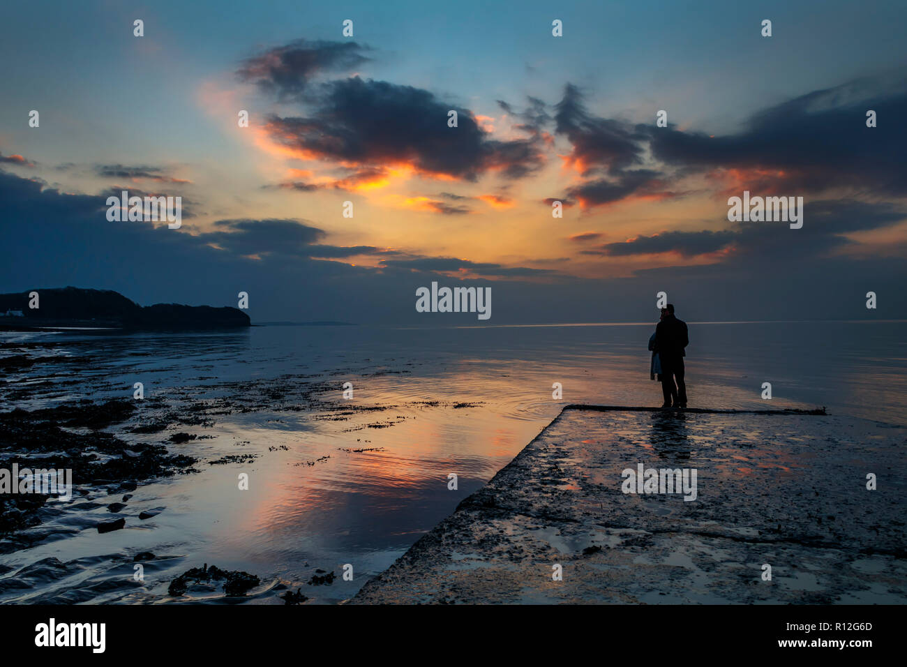 Couple having a cuddle hi-res stock photography and images - Alamy