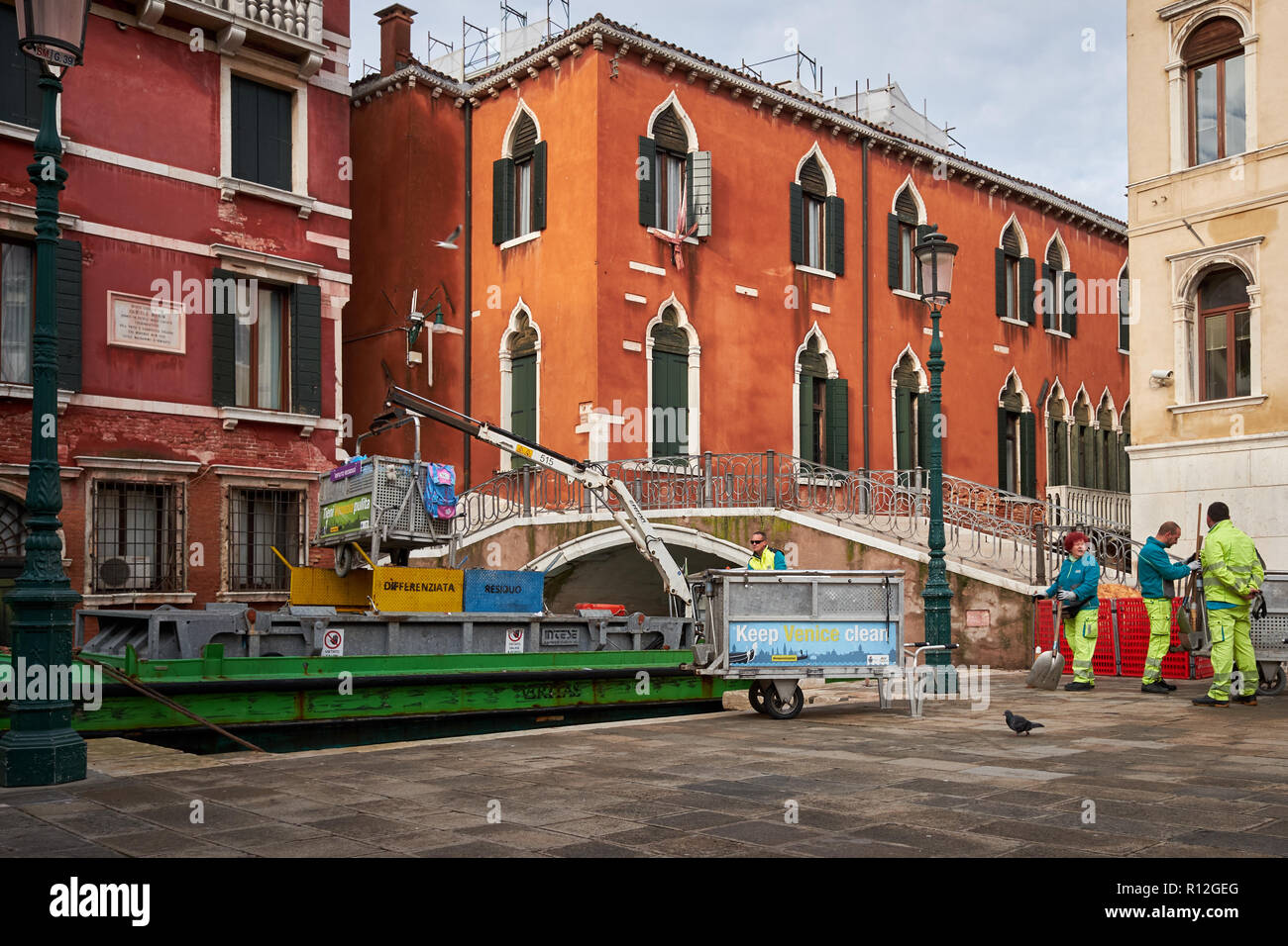 Venice / Italy - November 3rd 2018: Council workers using barges on the ...