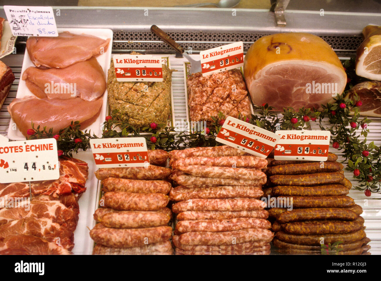 Pork Butchers shop refrigerated counter Stock Photo - Alamy