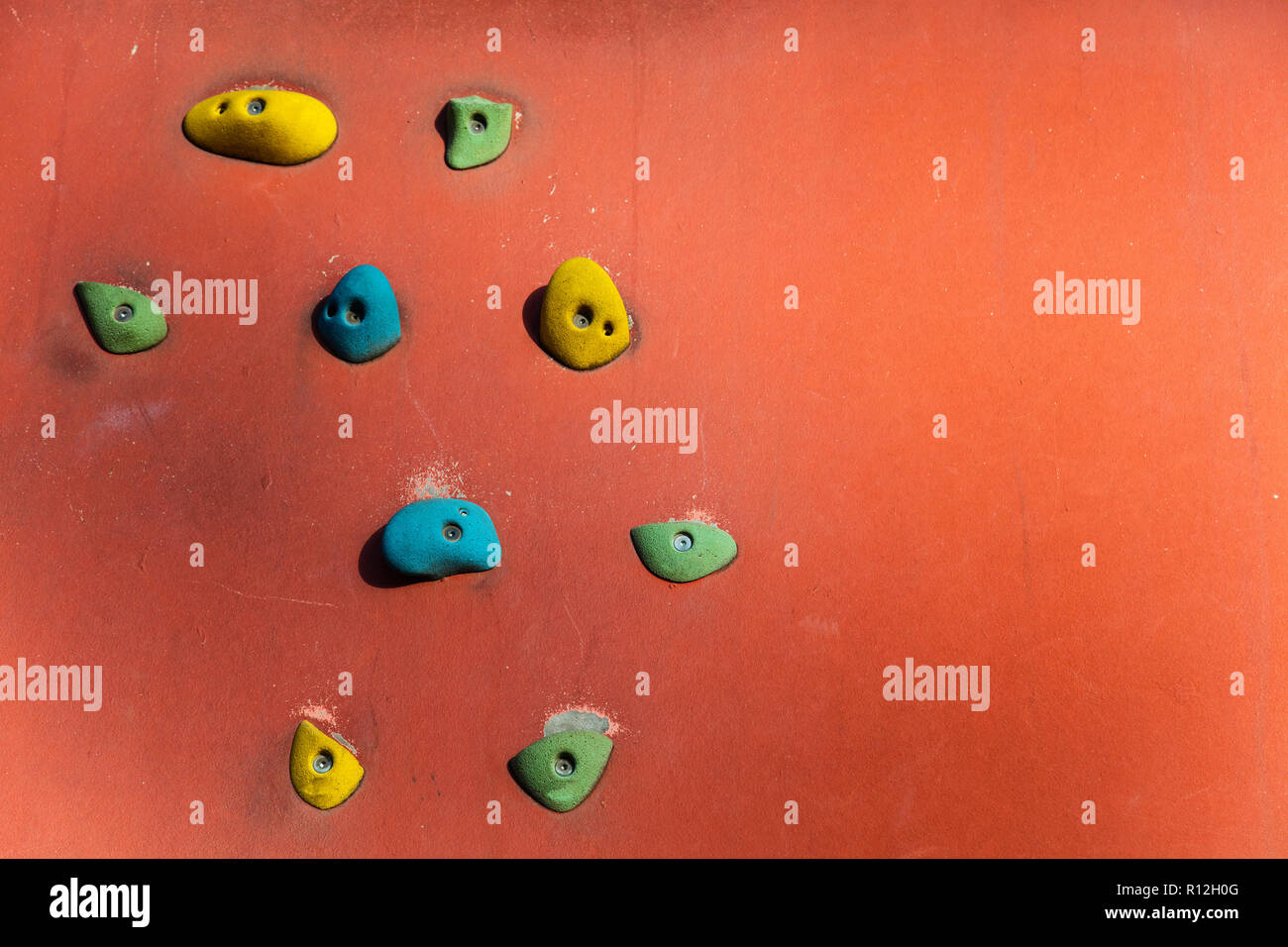 Rock climbing or Bouldering wall with colourful hand holds Stock Photo ...