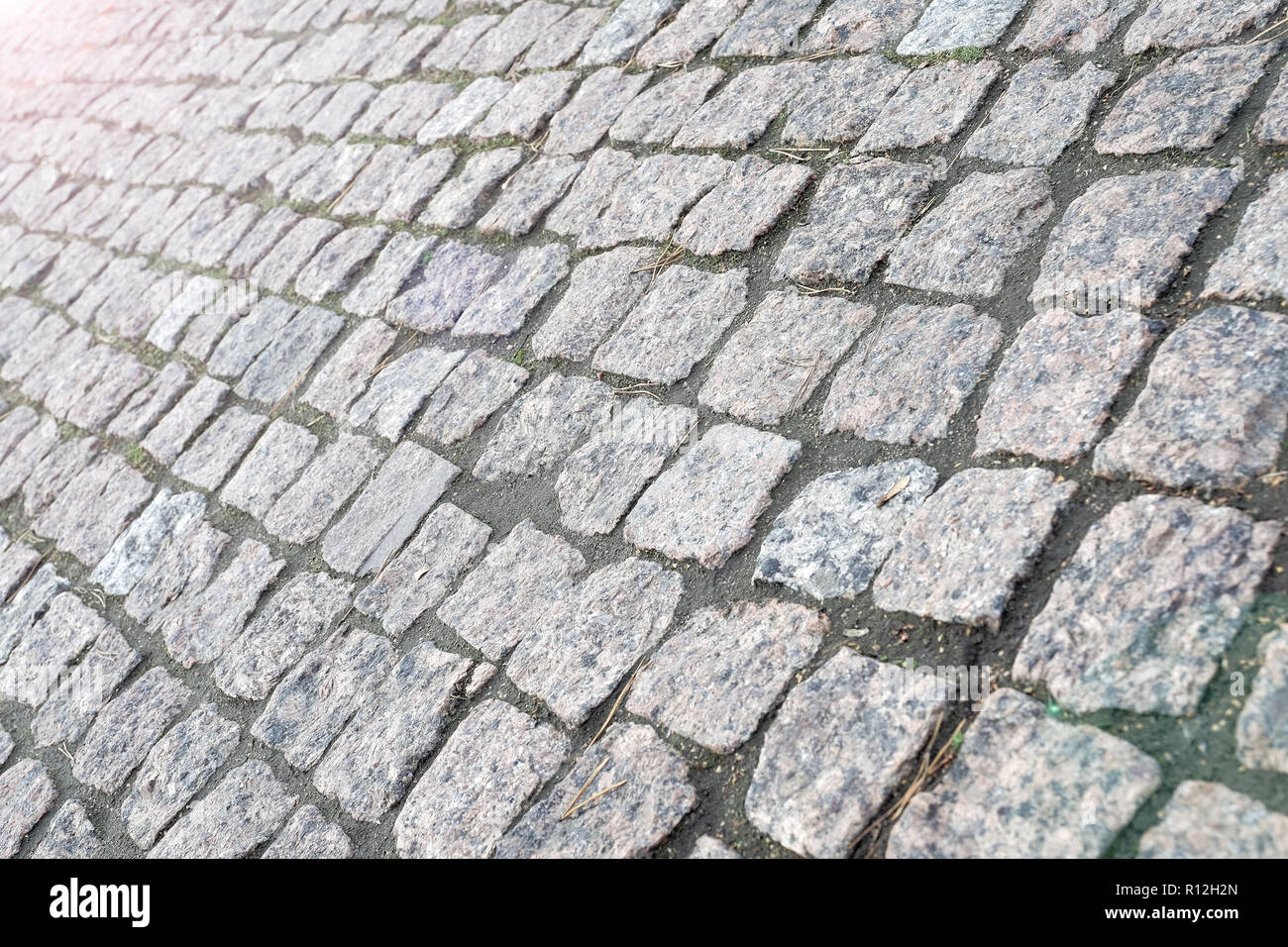 abstract the slope of the horizon. Ancient granite paving. Close-up ...