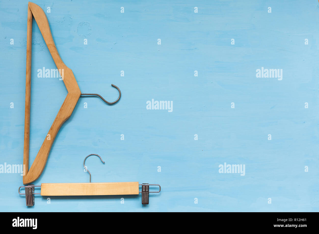 merchandise wooden hangers on a blue Stock Photo - Alamy