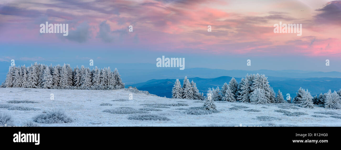 Amazing sunset on a mountain top - frozen landscape, vivid colors, cold ...