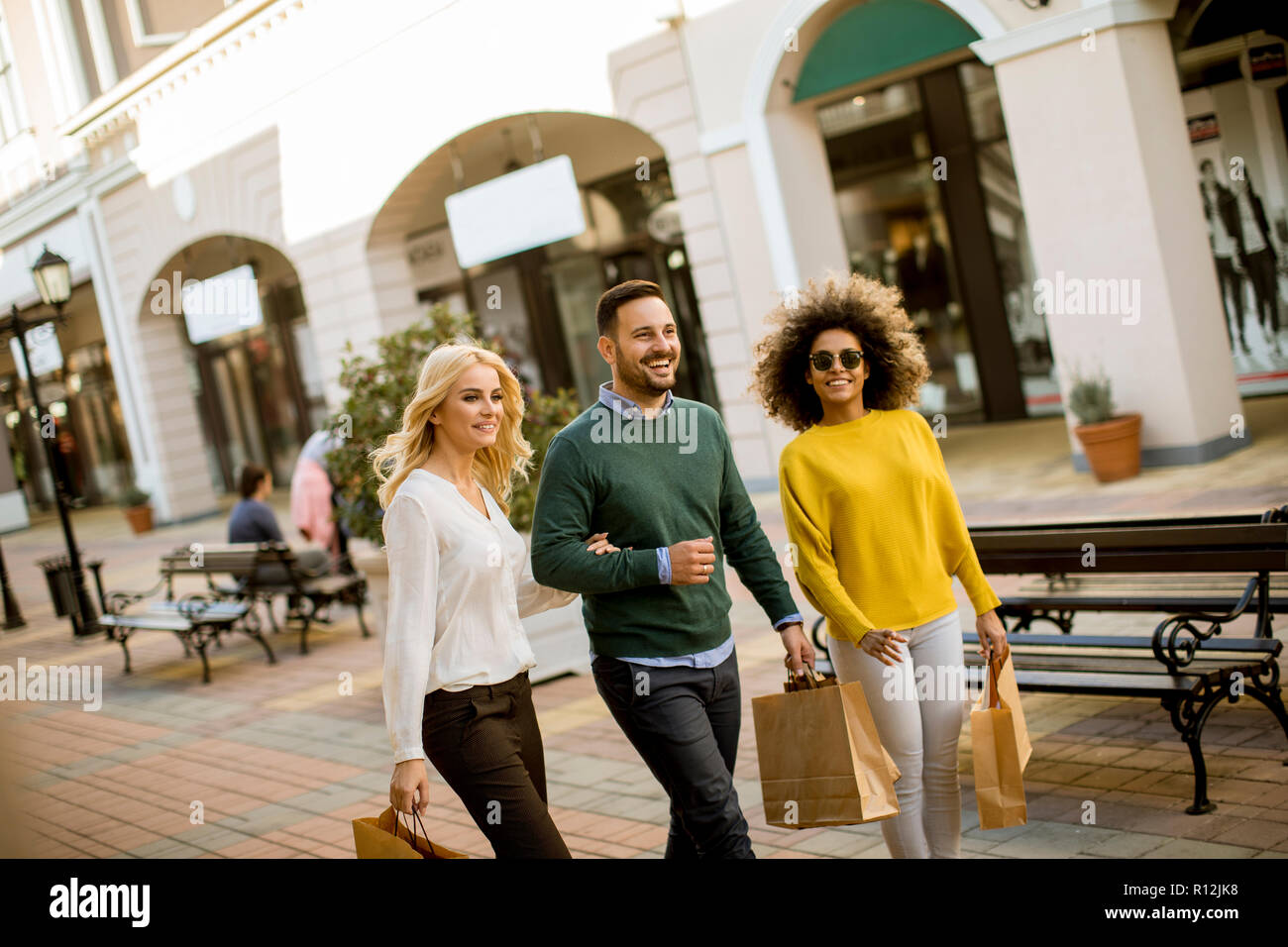 Group of young multiracial friends shopping in mall together Stock ...