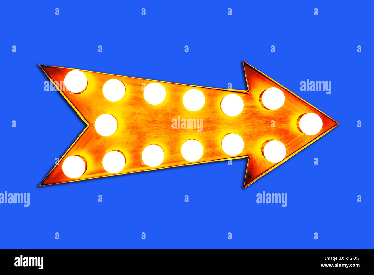 Yellow orange arrow shaped vintage colorful illuminated metallic ...