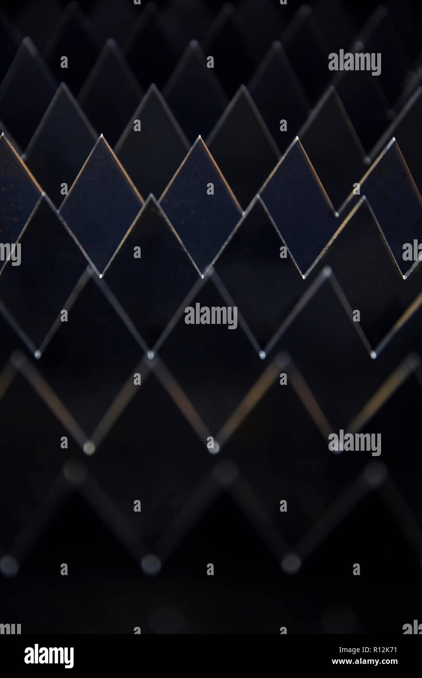 Detail of the sheet metal spikes backdrop Stock Photo - Alamy
