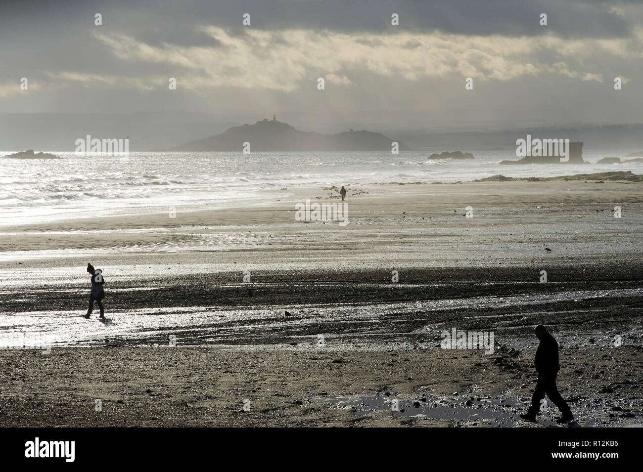 People beachcombing on Seafield beach and Kirkcaldy seafront, Kirkcaldy ...