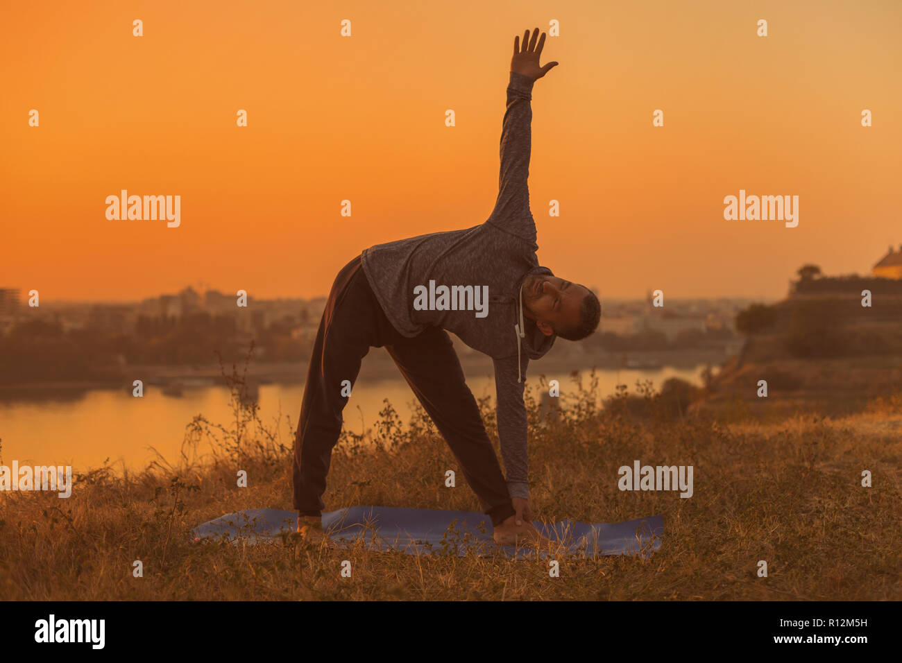 Triangle pose man hi-res stock photography and images - Alamy