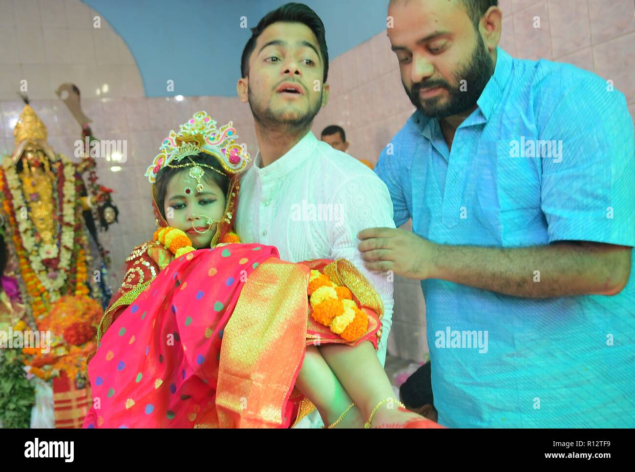 Somraggi Bhattacharjee aged 6 years 10 month and 19 days seen worshiped during the religious festival of Kali Puja in the northeastern Indian city of Agartala. Kumari is a young virgin girl