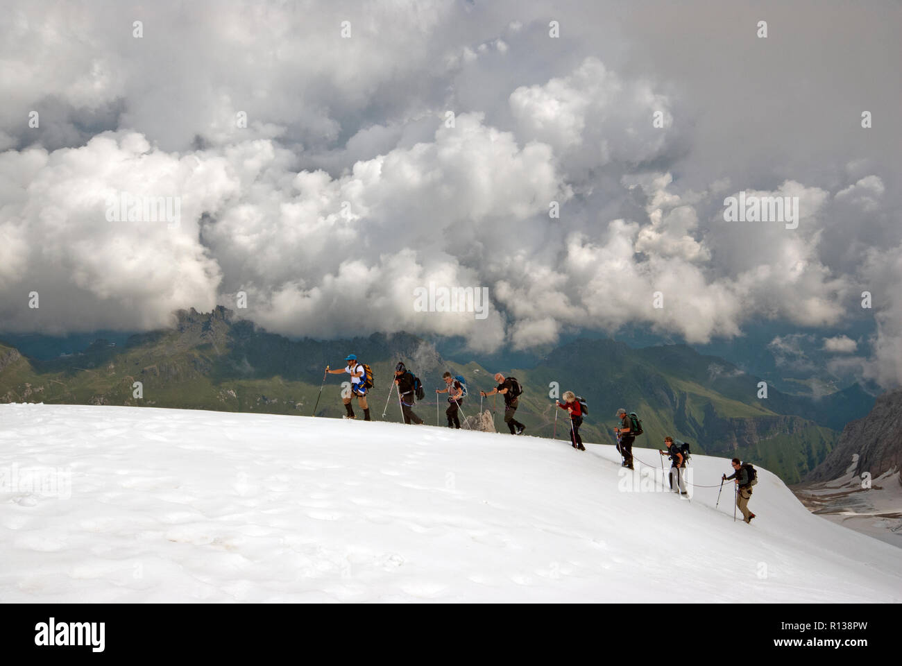 Mountaineers in roped party climbing the Marmolada glacier, Veneto ...