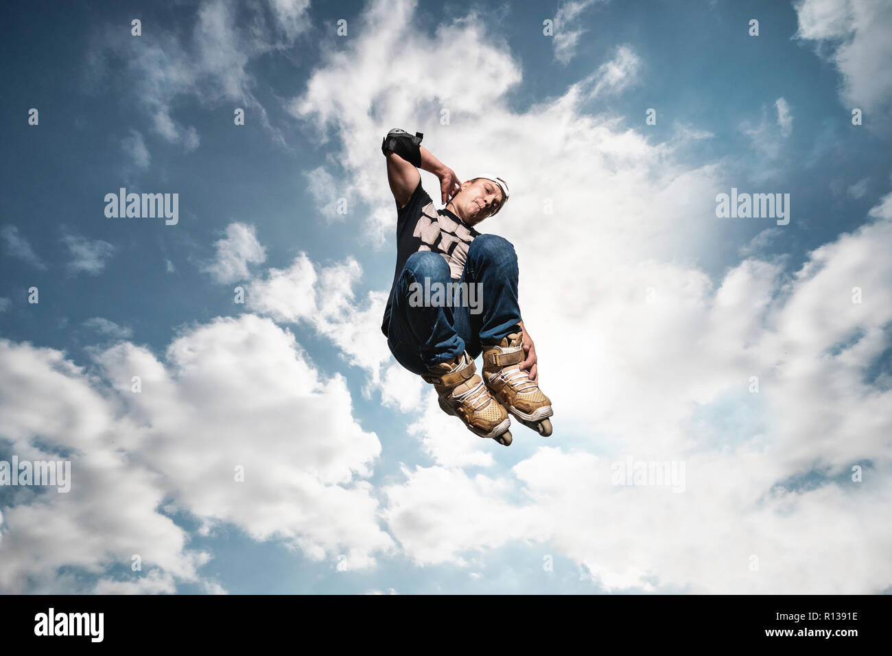 Inline skating jump Stock Photo - Alamy