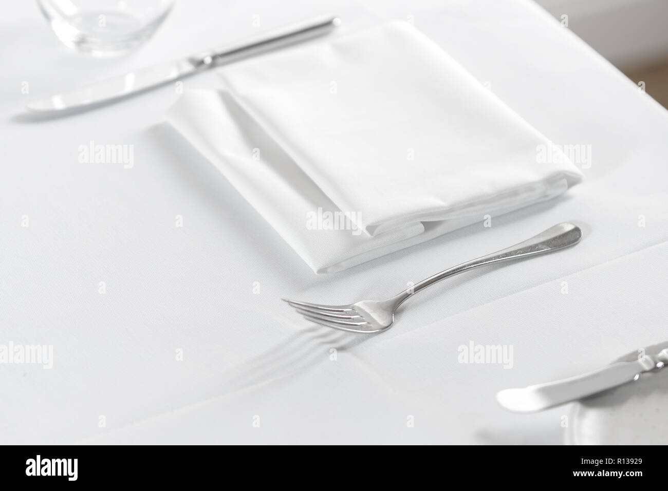 Food tableware tableclotch with work, knife and napkin background Stock ...