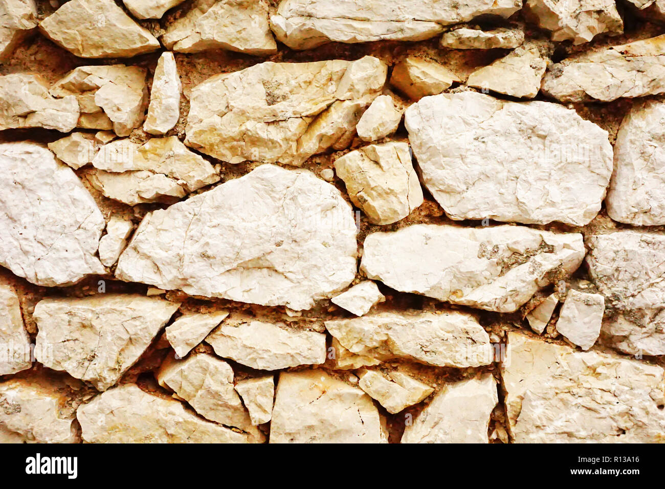 Stone wall surface. Rock wall with cement Stock Photo - Alamy