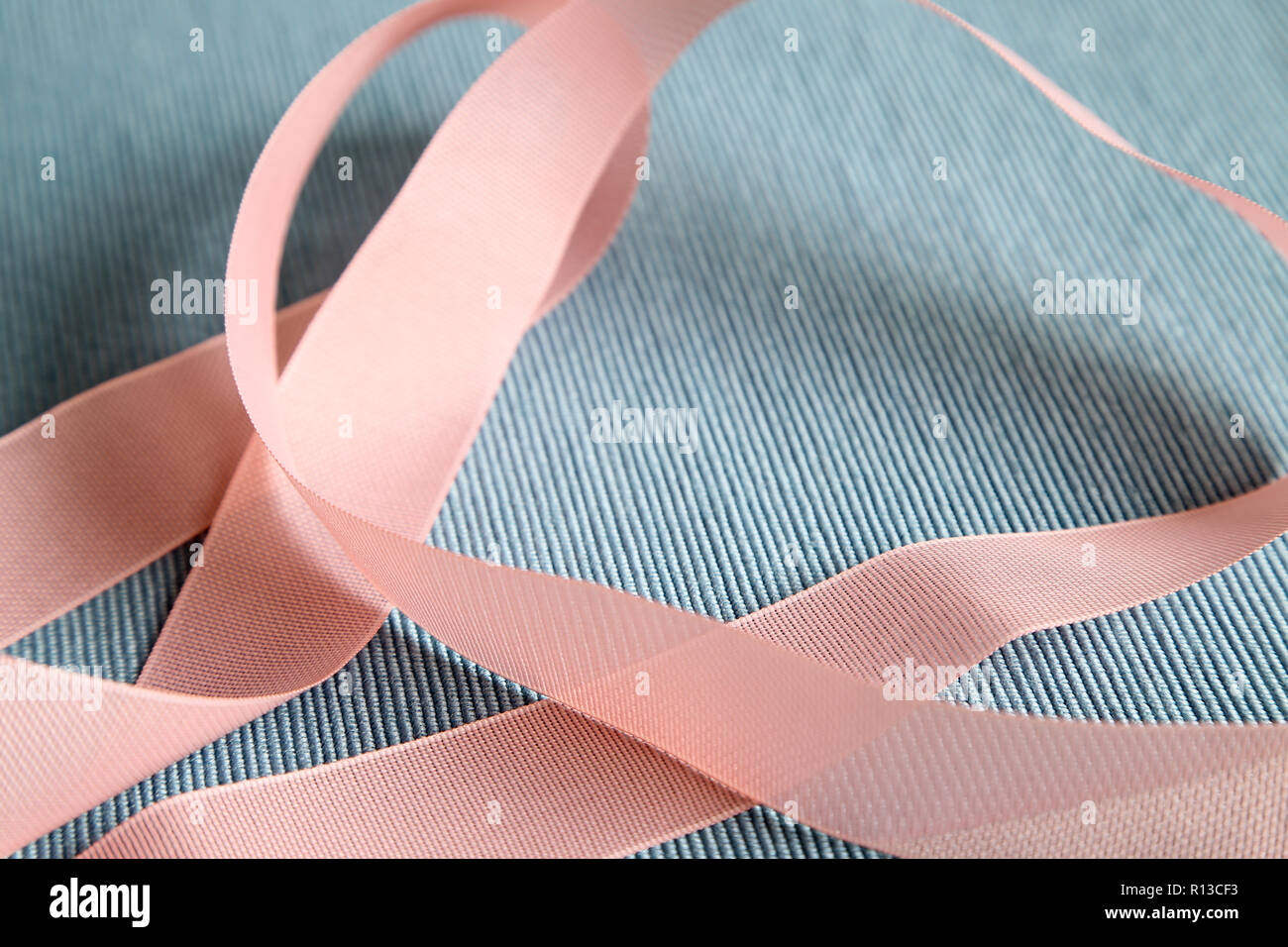 Curly pink ribbon on hi-res stock photography and images - Alamy