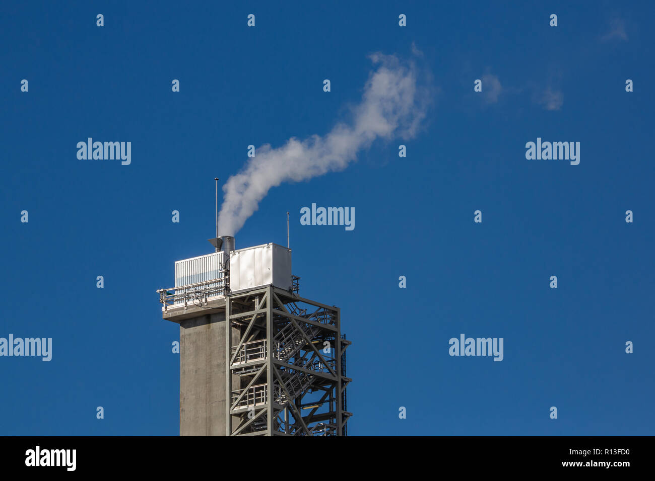 Steam from oil refinery tower. Norway Stock Photo - Alamy