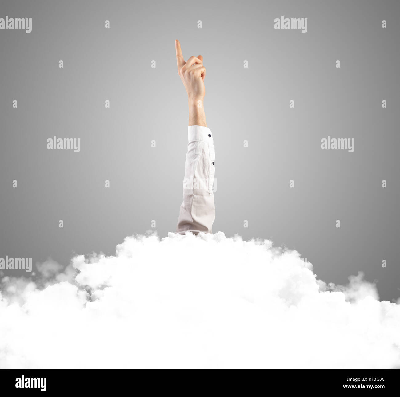 Hand breaking out from the cloud Stock Photo - Alamy