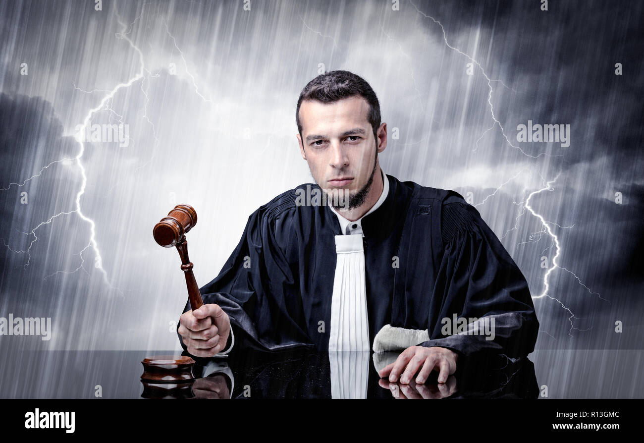 Young handsome judge with stormy wallpaper Stock Photo - Alamy